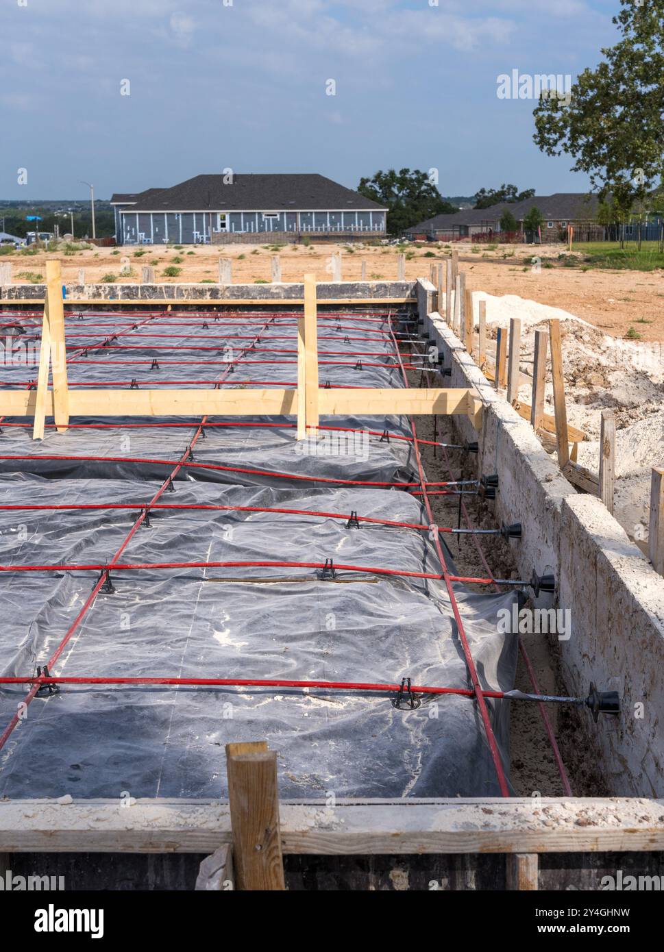 Trenches in the sand for plumbing and drain pipework with waterproofing ...