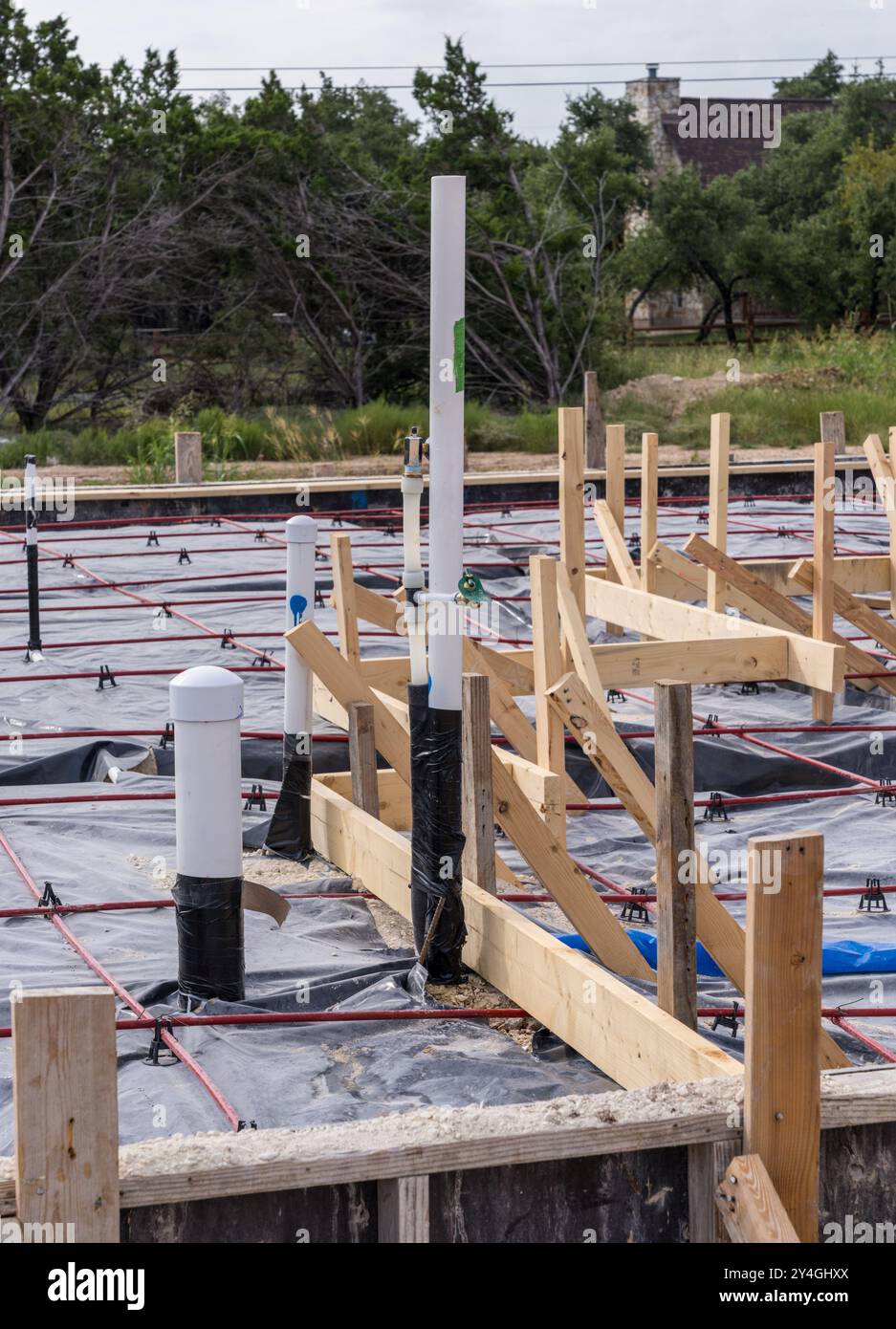 Trenches in the sand for plumbing and drain pipework with waterproofing ...