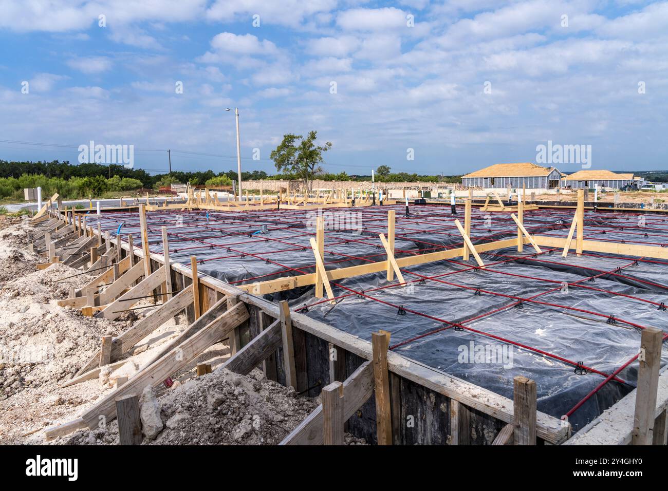 Trenches in the sand for plumbing and drain pipework with waterproofing ...