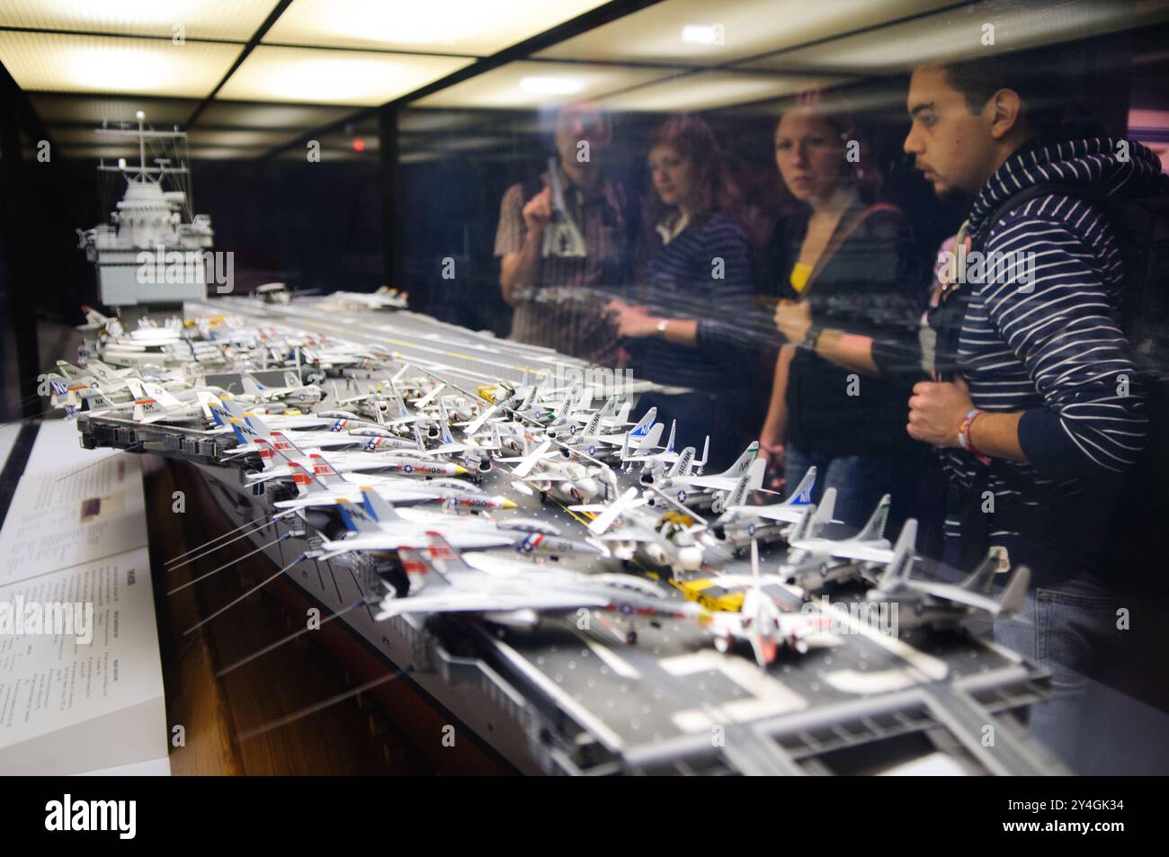 Visitors to the National Air and Space Museum look at a detailed model ...