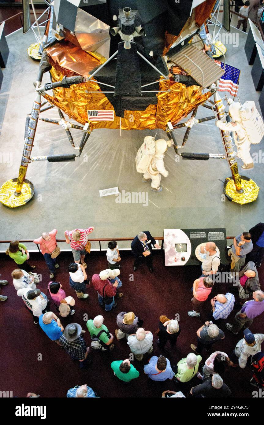 Visitors to the National Air and Space Museum listen to a guide explain ...
