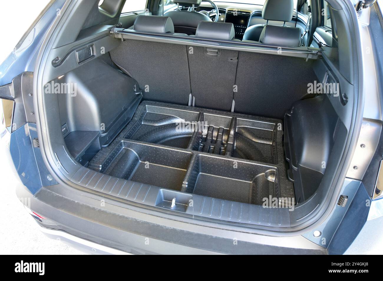 Raised the first floor of the trunk of the car Stock Photo - Alamy