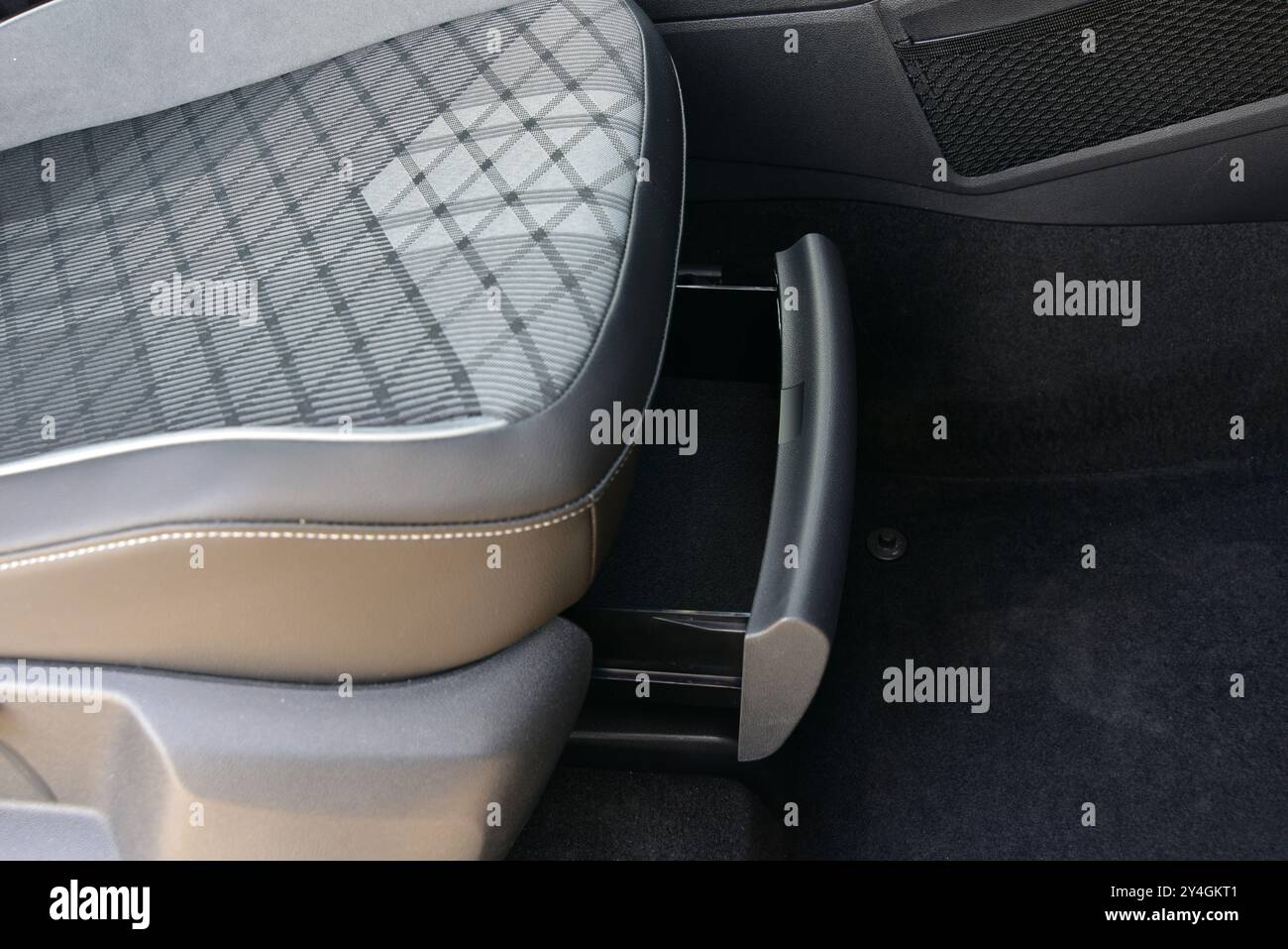 Drawer under car passenger seat Stock Photo - Alamy