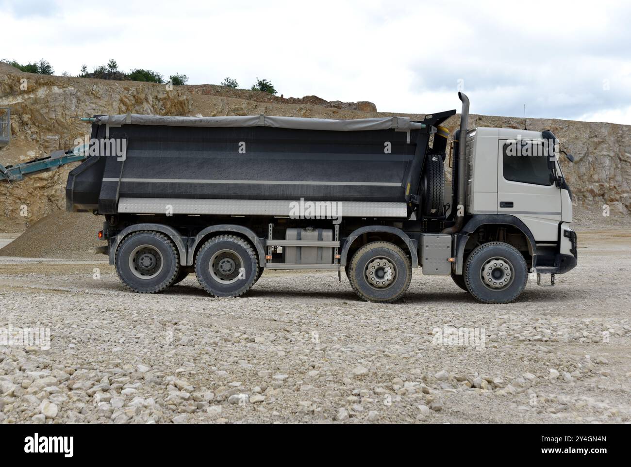 Big truck tipper drives in a quarry Stock Photo - Alamy