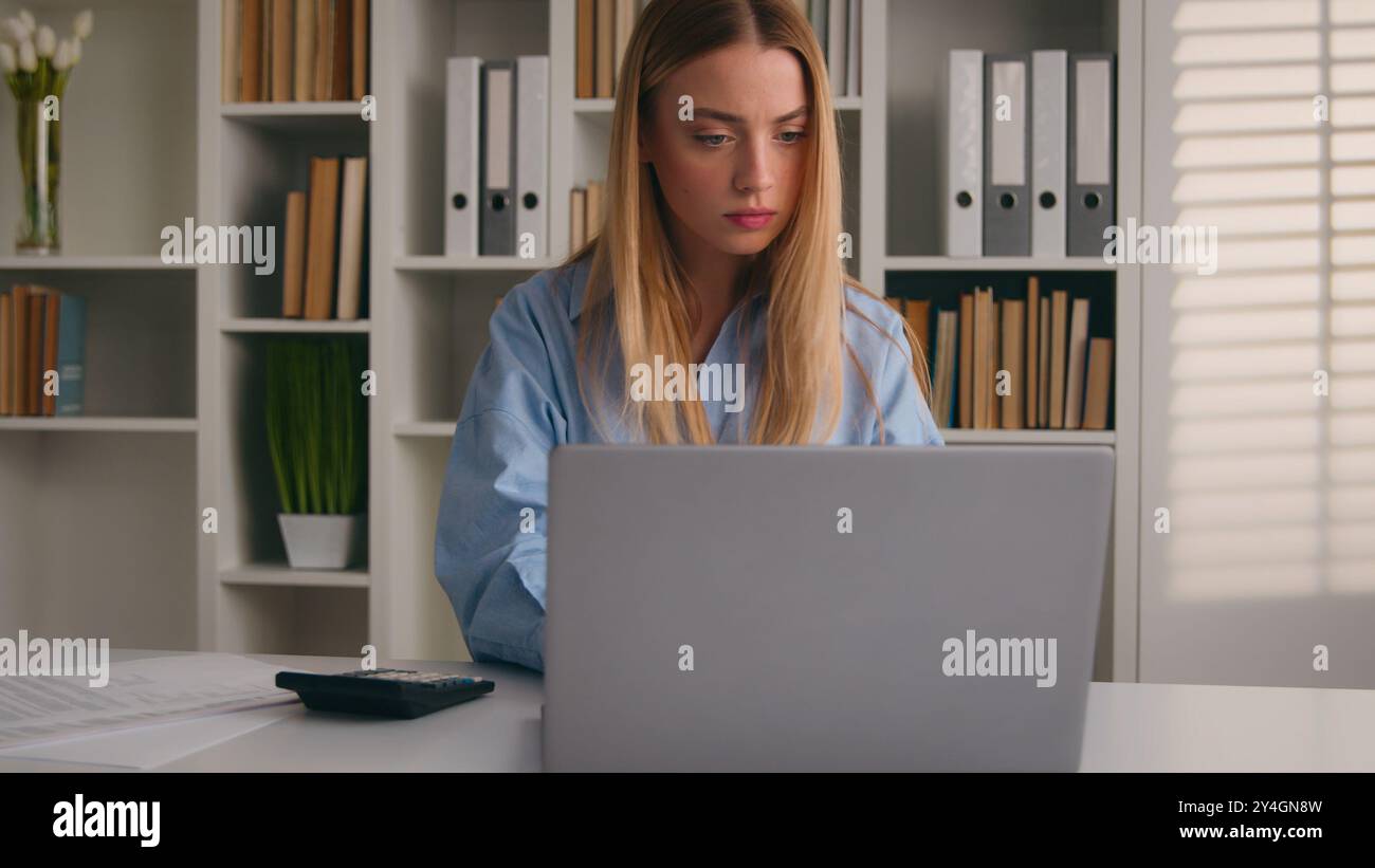 Confused puzzled Caucasian girl woman at office counting money business ...