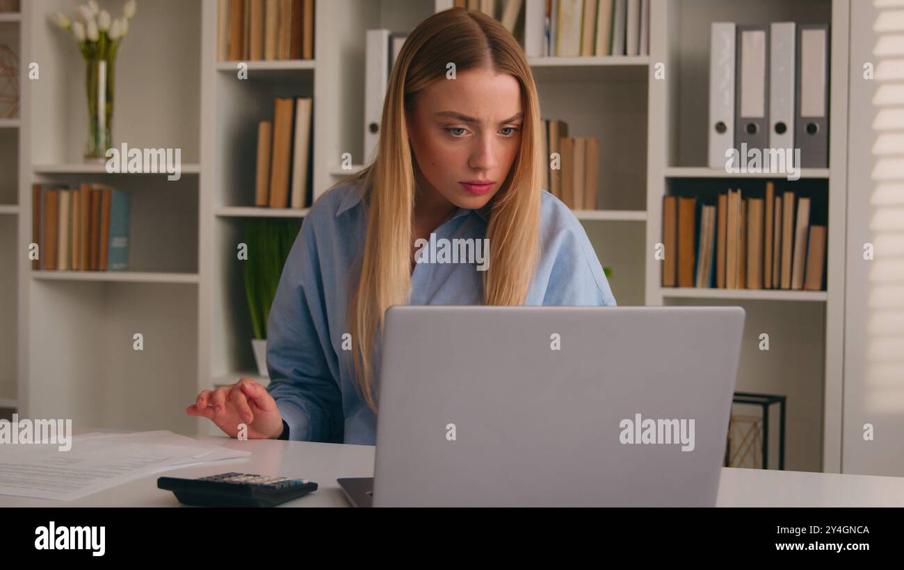 Exhausted frustrated Caucasian girl woman at office table failure angry ...