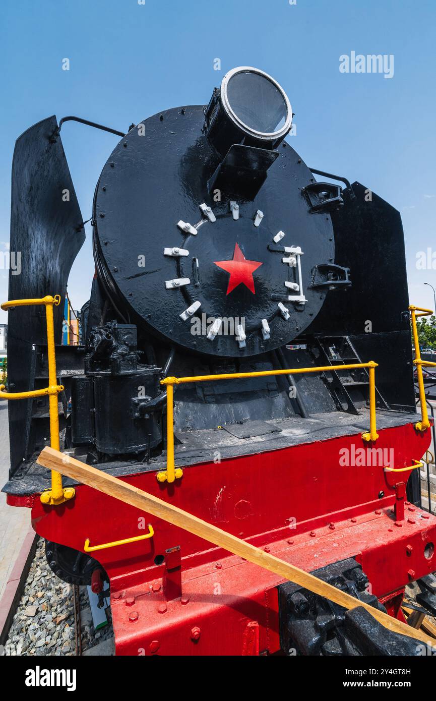 Vintage black steam locomotive train railway station. vertical photo ...