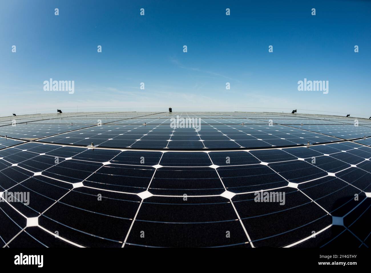 An array of solar photovoltaic panels used for converting sunlight into ...