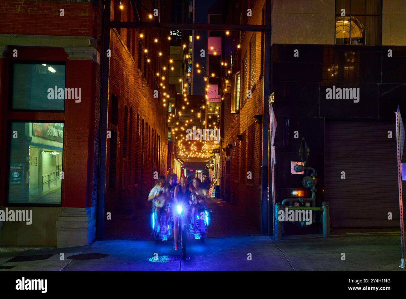 Bicycles with Blue Lights in Festive Nashville Alley at Eye Level Stock ...