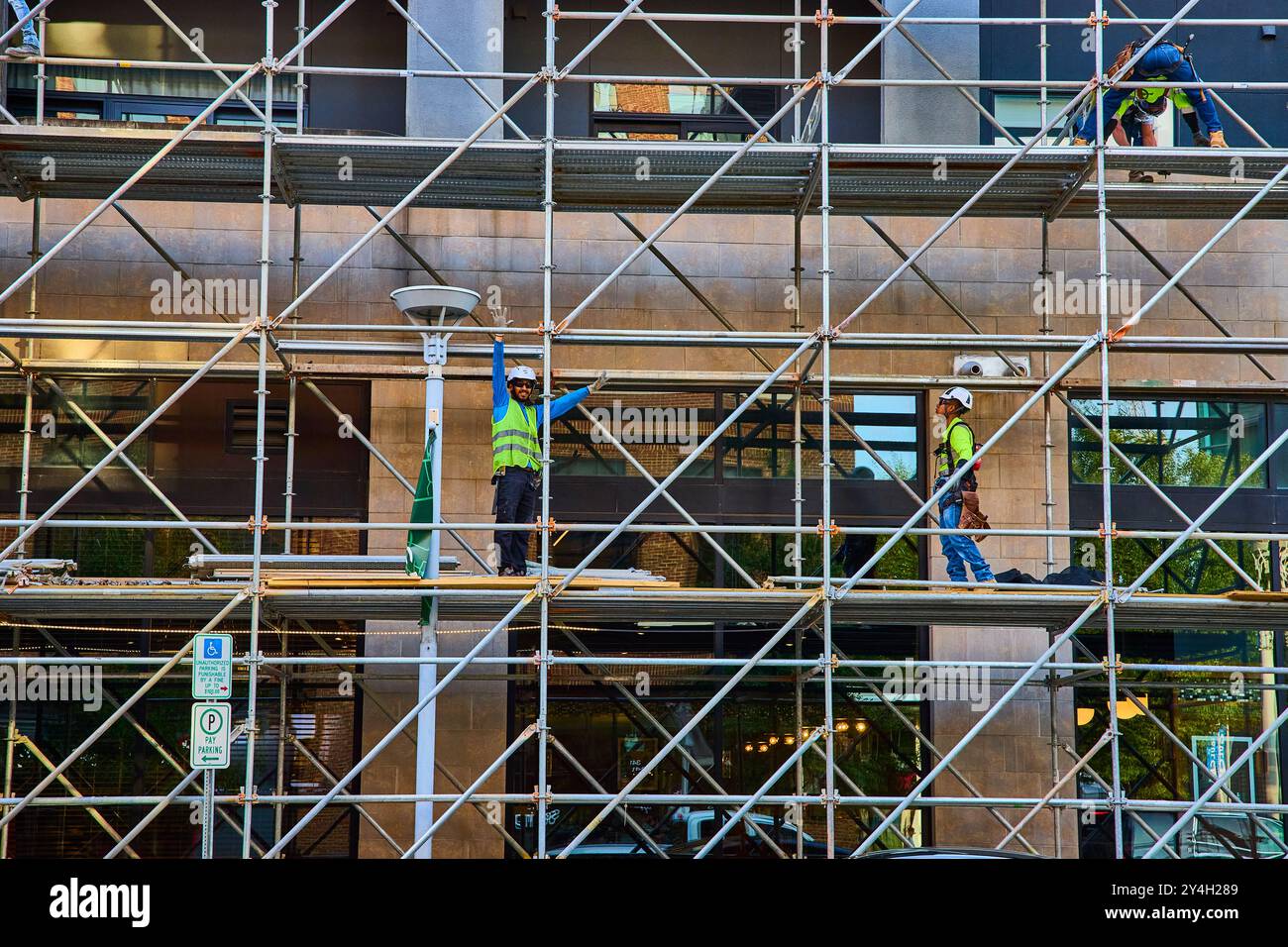 Construction Workers on Scaffolding in Motion Daytime Perspective Stock ...