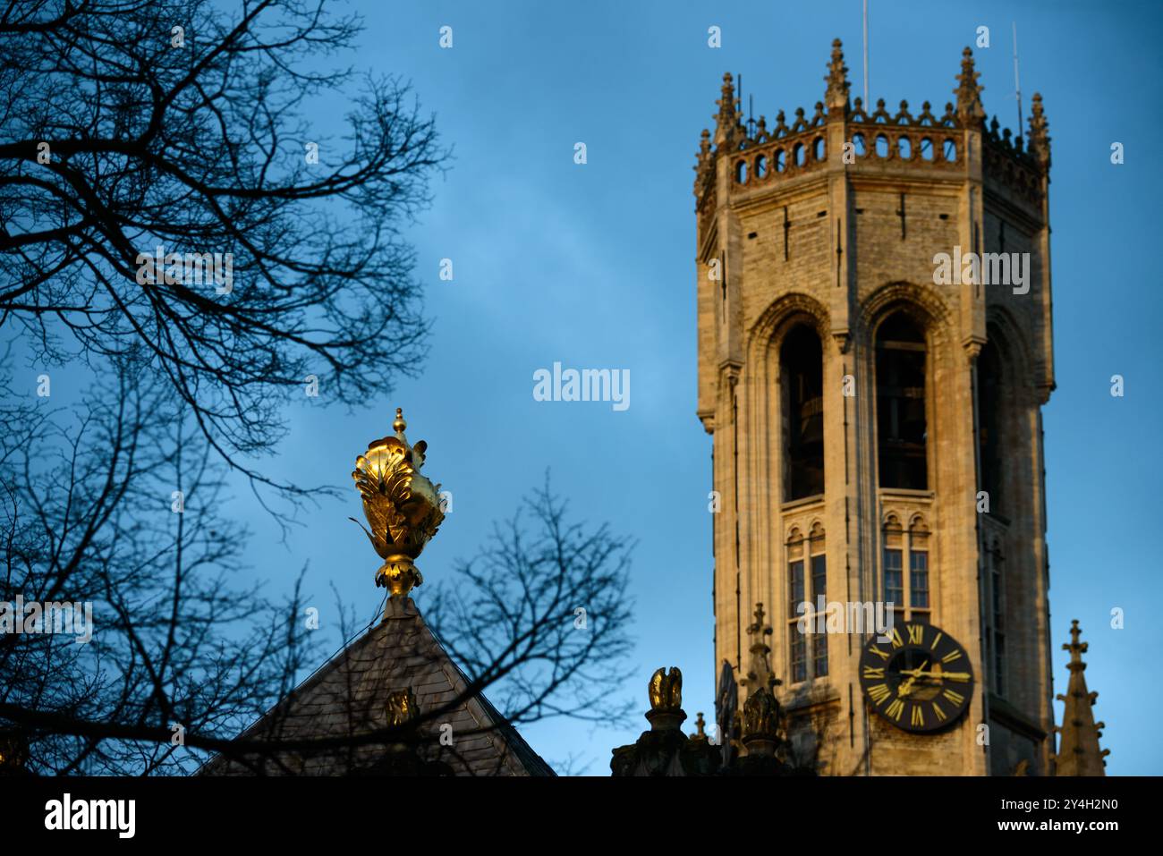 BRUGES, Belgium — The historic Belfry of Bruges catches the first rays ...