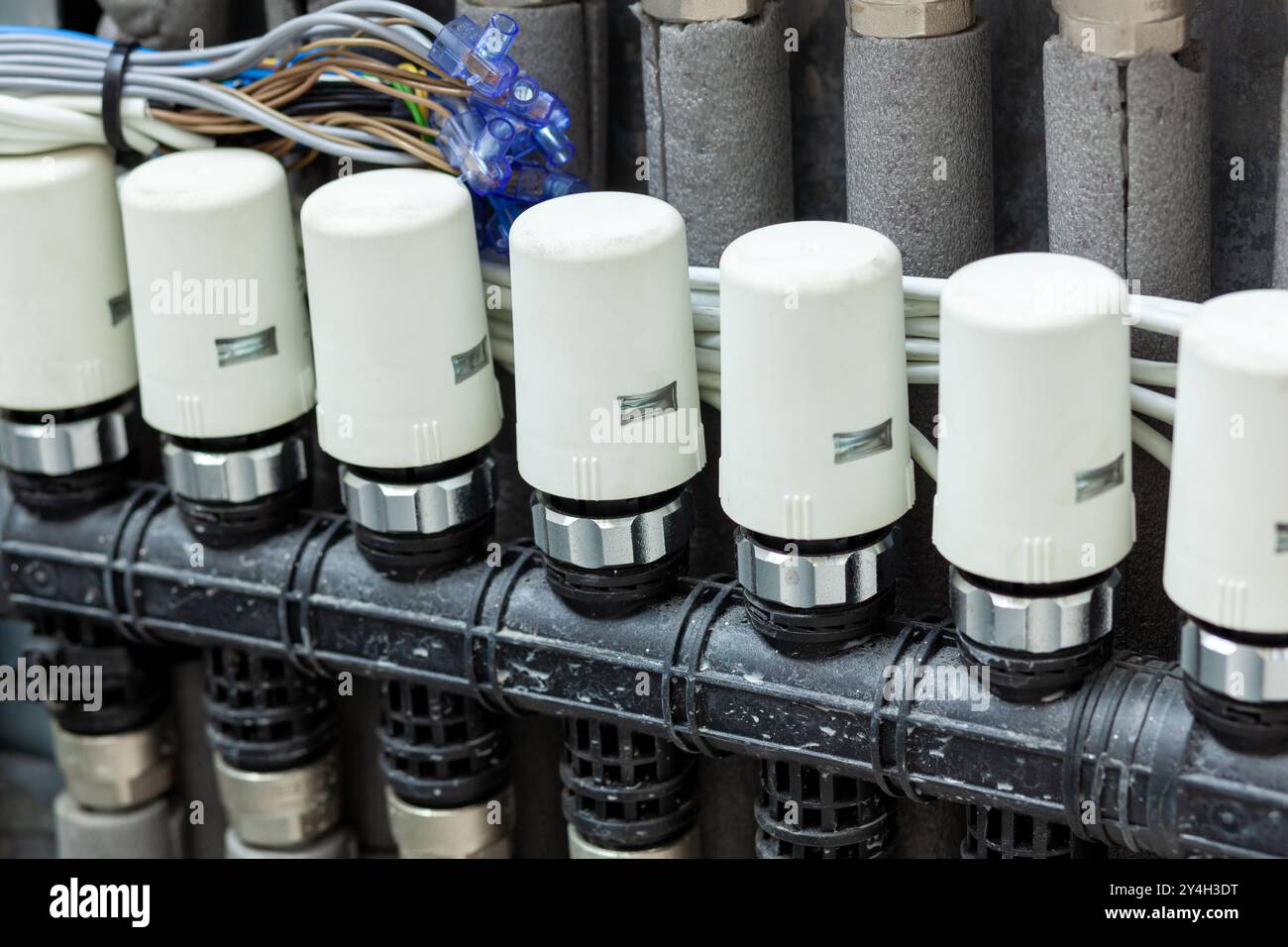 Plumbing system with pipes and solenoid valves that regulate the water ...
