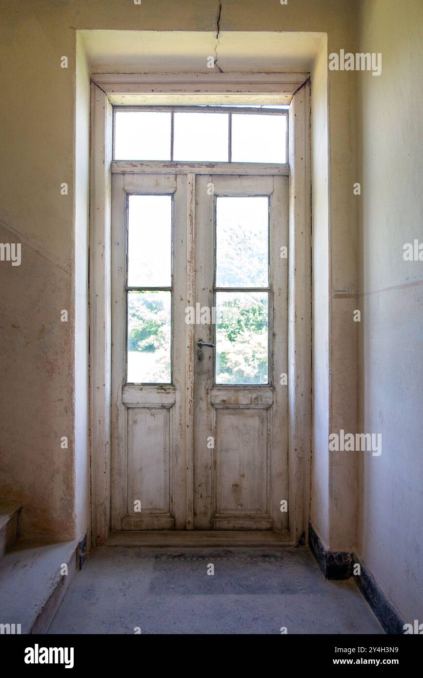 door in an old house, corridor with glass old door, interior view of ...