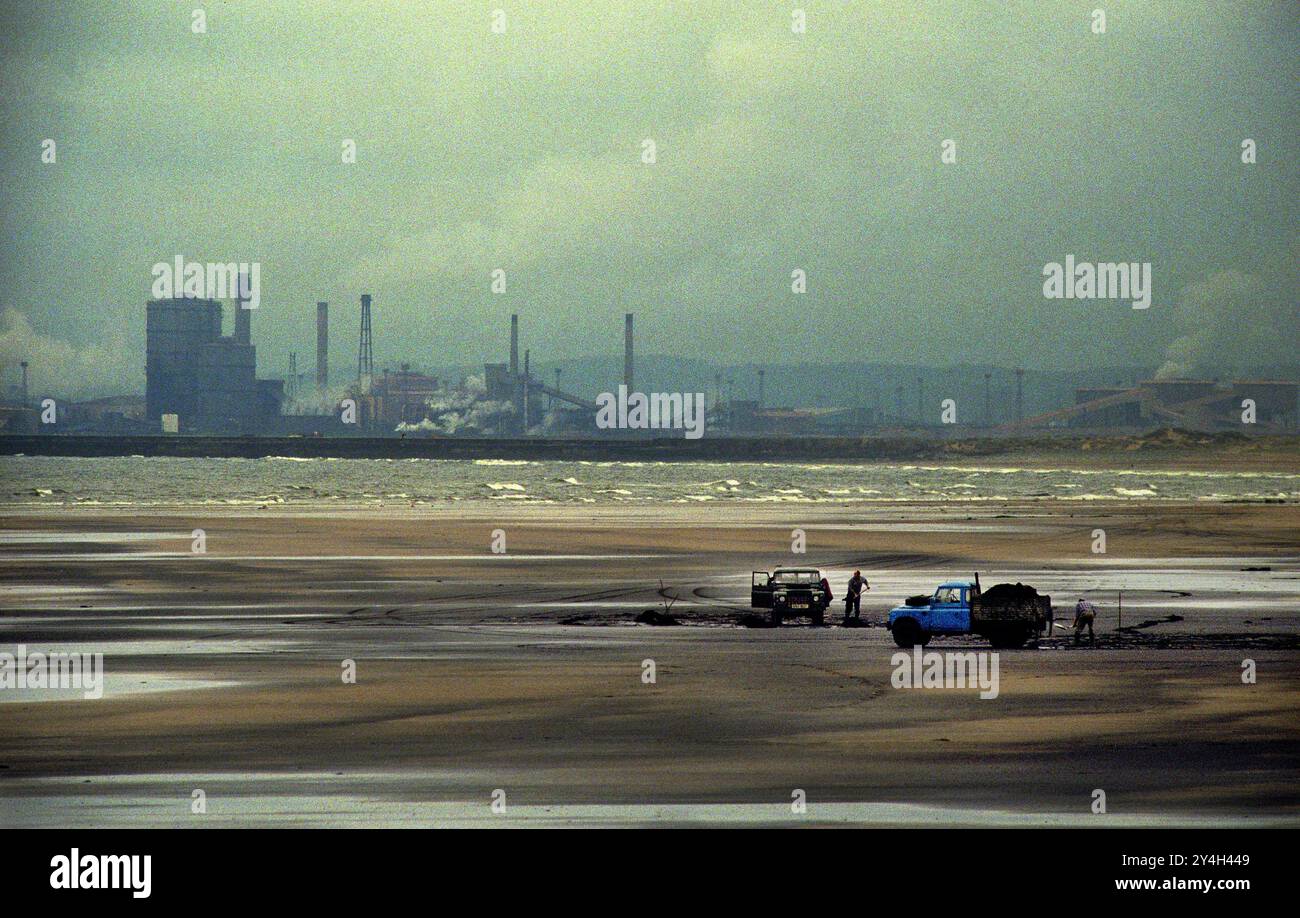 Redcar Beach looking towards Redcar Steel Works in 2001 Men gleaning ...