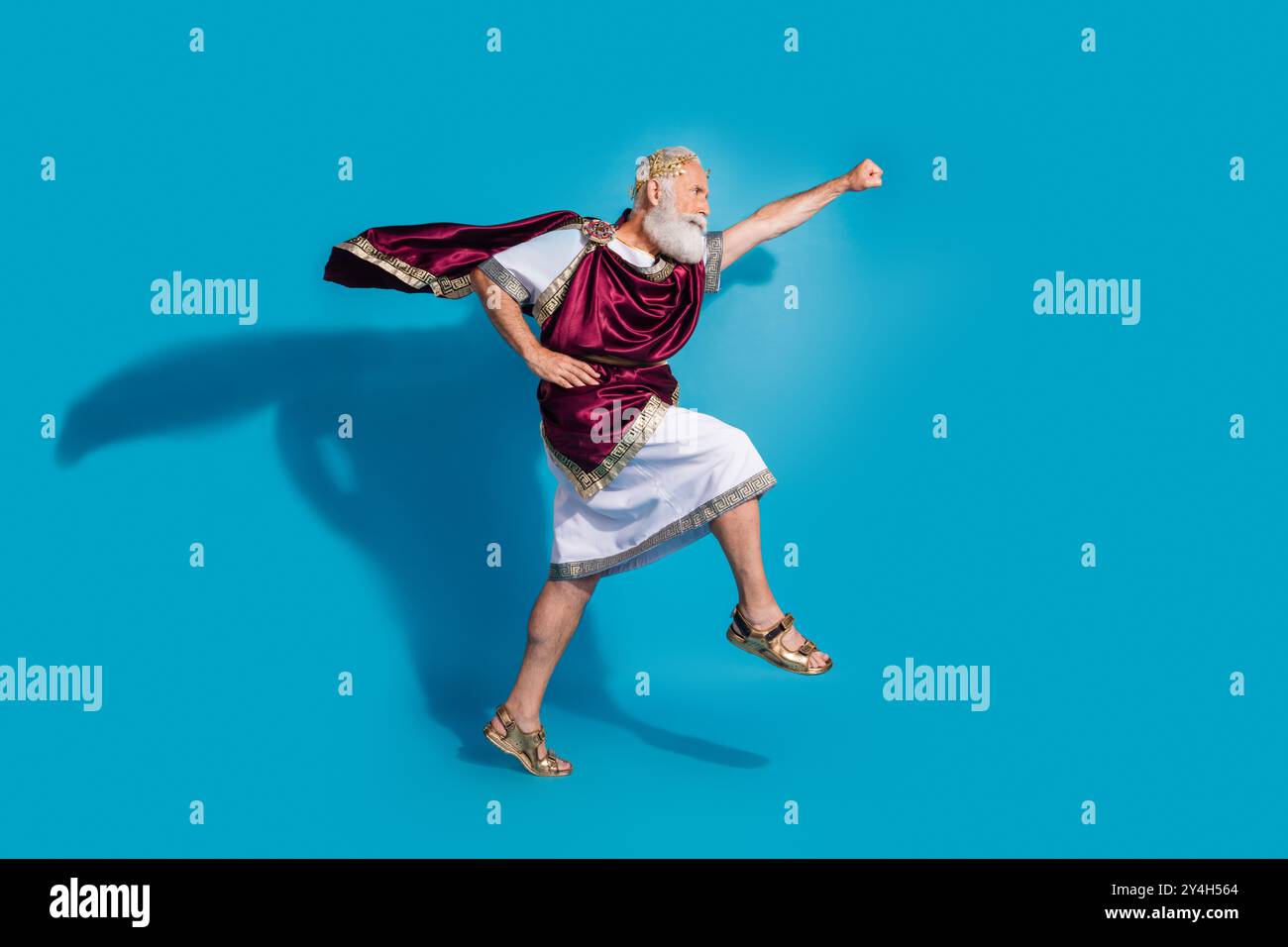 Full size photo of powerful mature man raise fist flying running wear ...