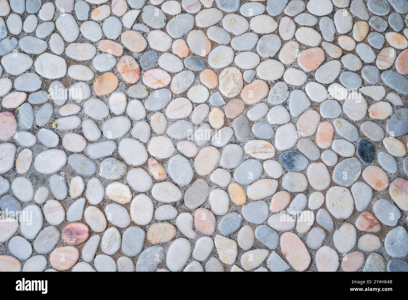 Wall round stone rock texture. background Stock Photo - Alamy