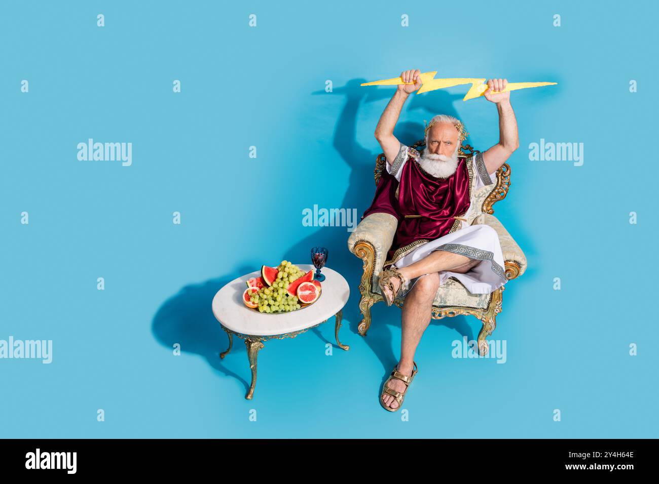 Full body above view portrait of furious ancient god sit throne hands ...