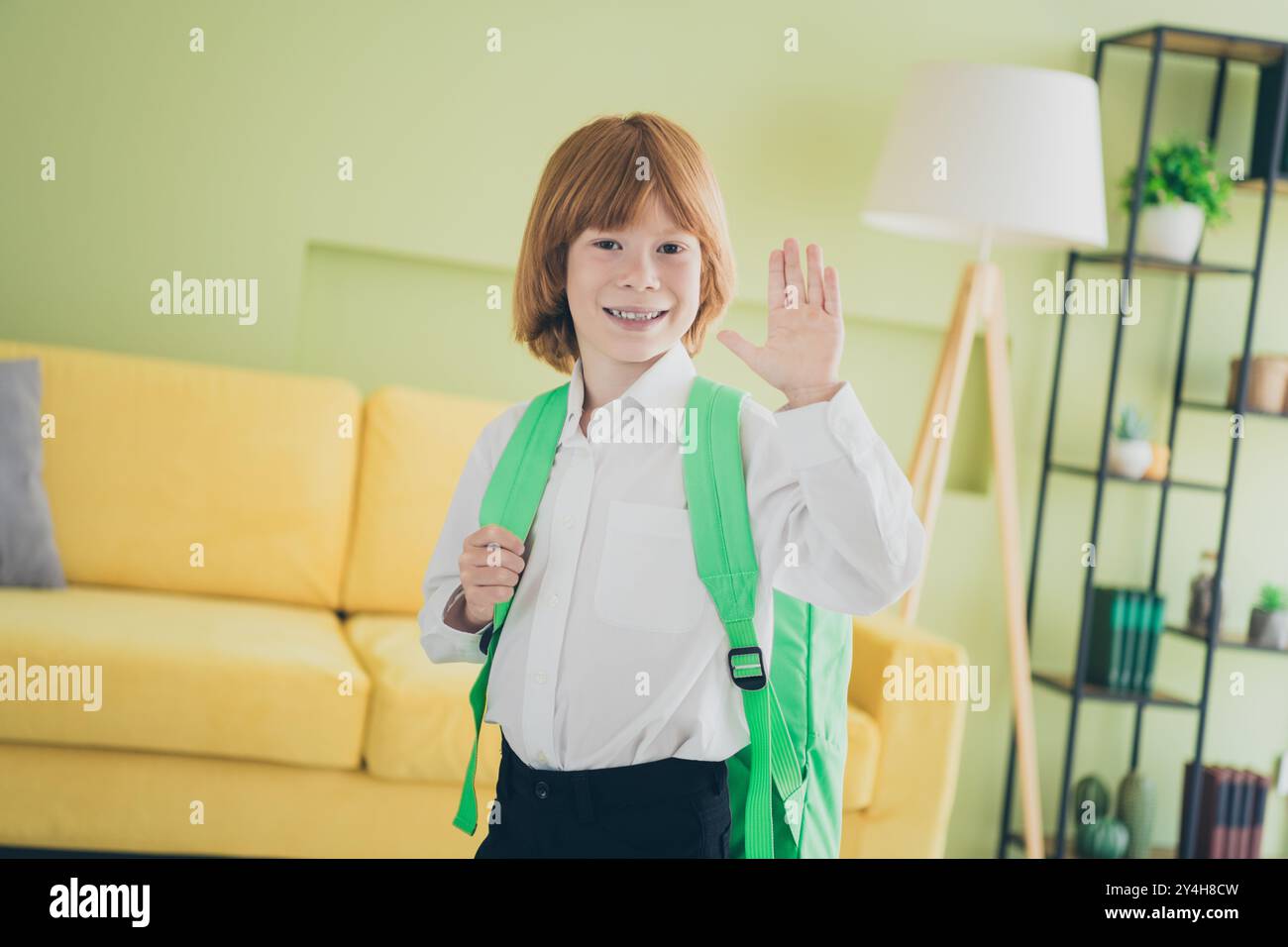 Portrait of cute charming smart little boy learner schoolkid wearing ...