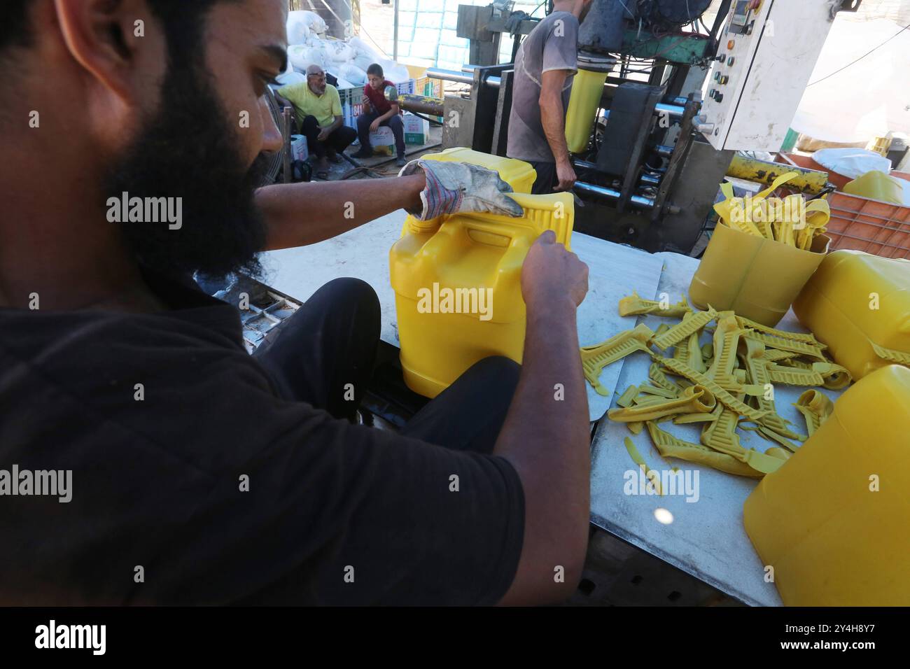 Hamouda Al-Ashi, owner of a plastic factory dedicated to making olive ...