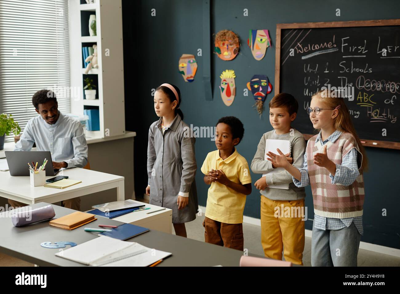 Adorable young students from diverse ethnic backgrounds standing in ...