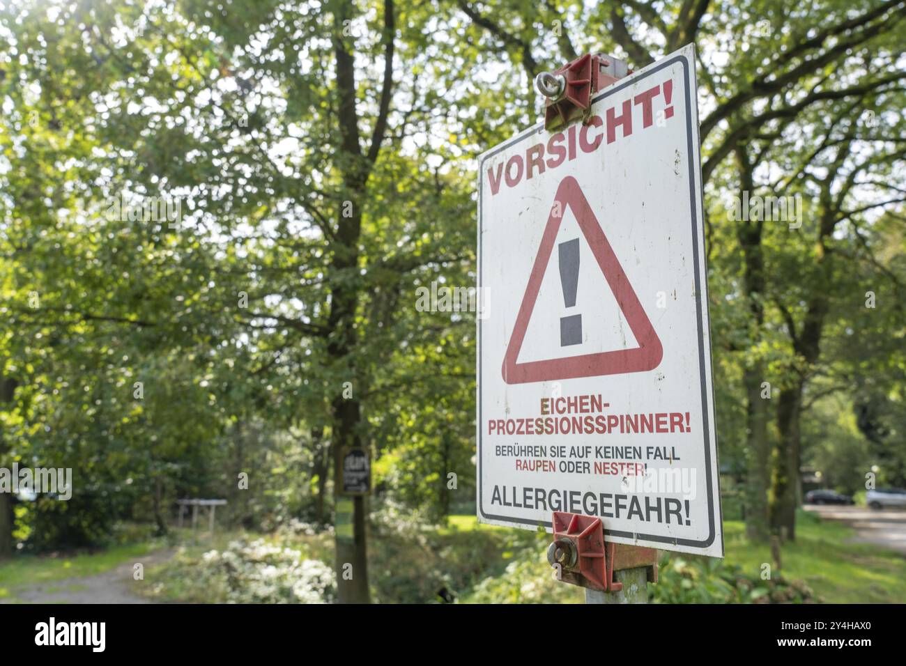 Warning of the oak processionary moth, in a public park, touching can ...