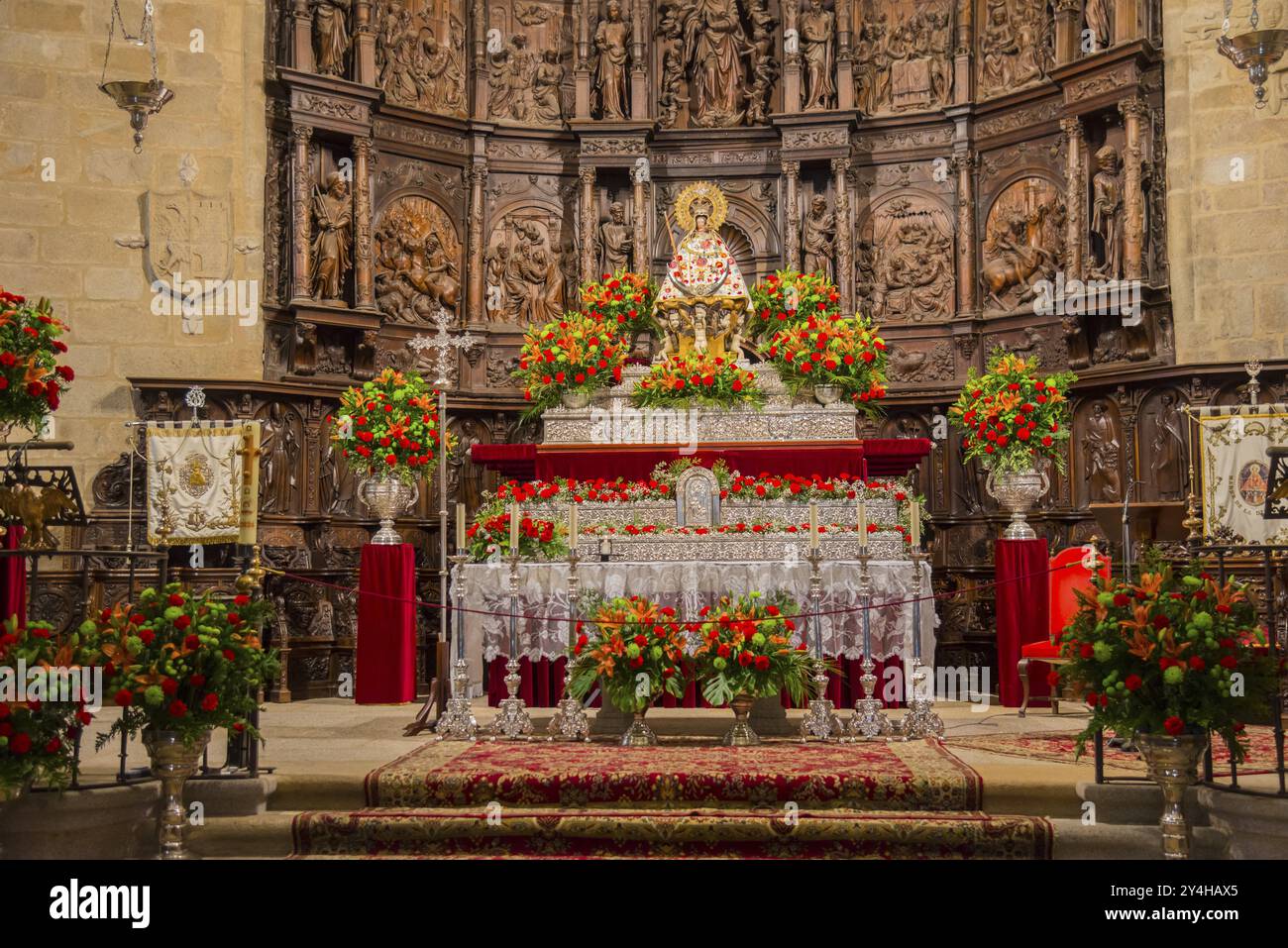 Magnificently decorated chancel of a church with richly ornamented wood ...