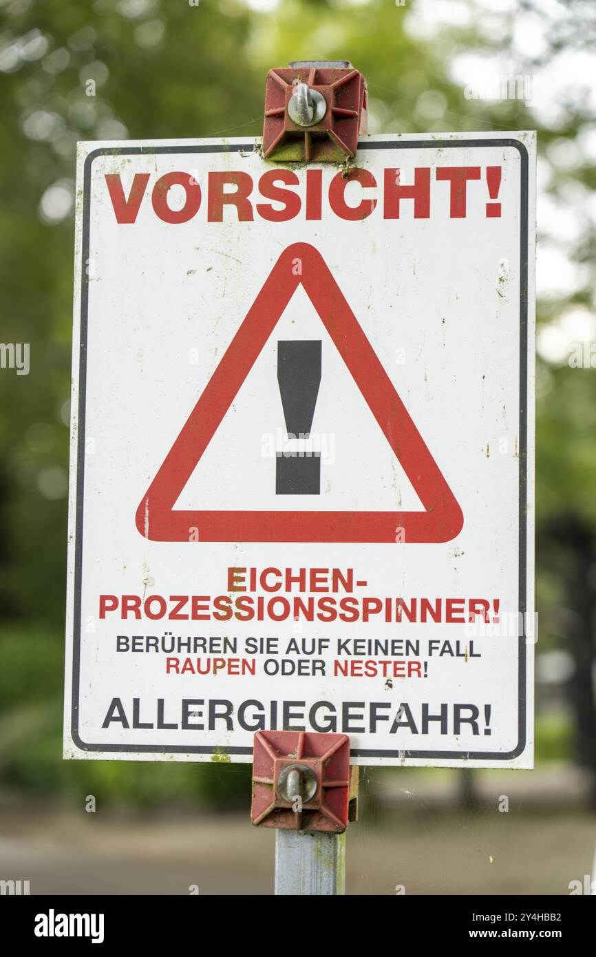 Warning of the oak processionary moth, in a public park, touching can ...