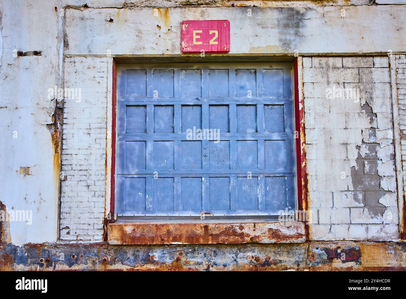 Weathered Industrial Door with E2 Sign Eye-Level View Stock Photo - Alamy
