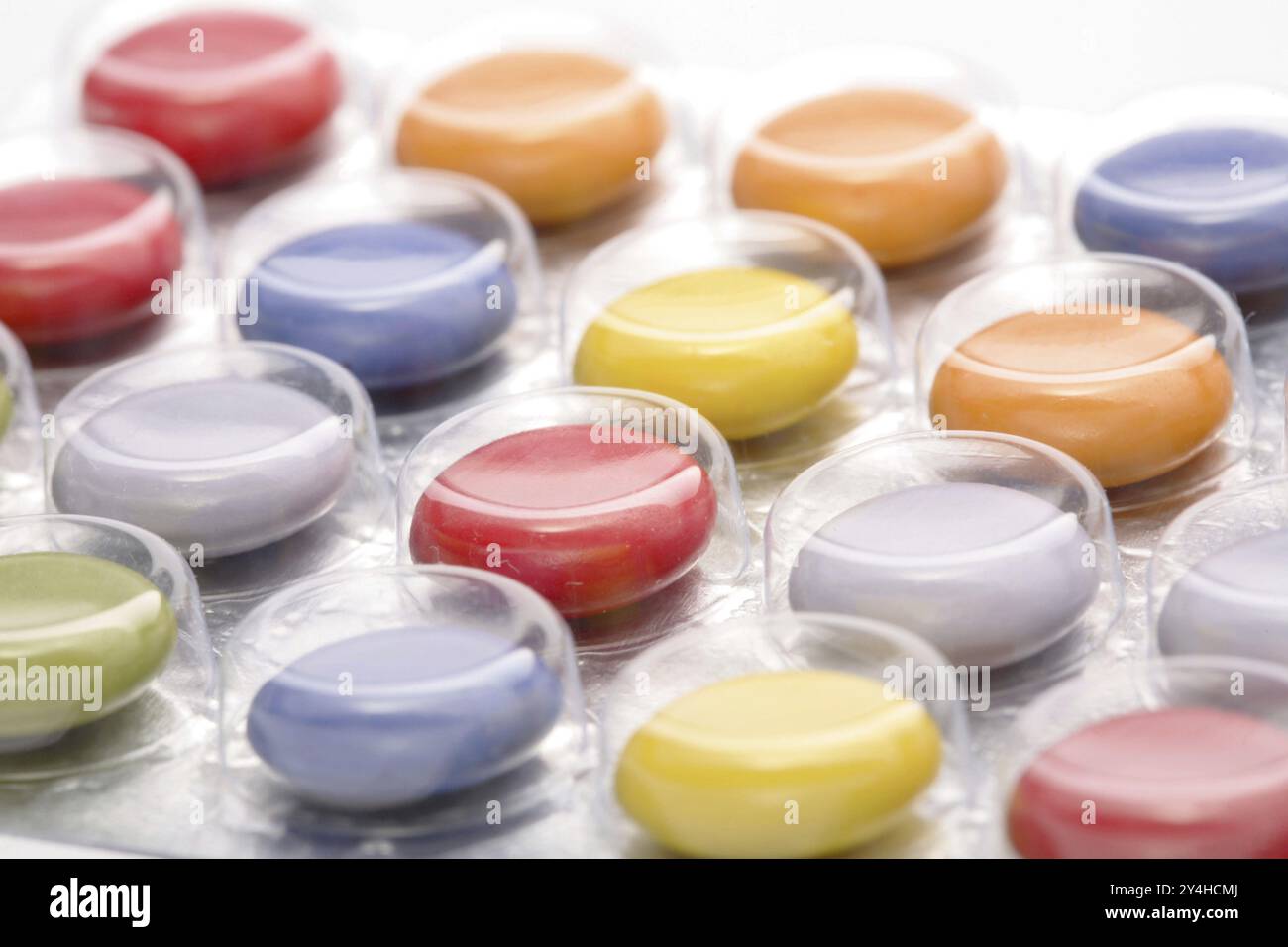 Colourful tablets packed in plastic, tablet addiction, drug addiction ...