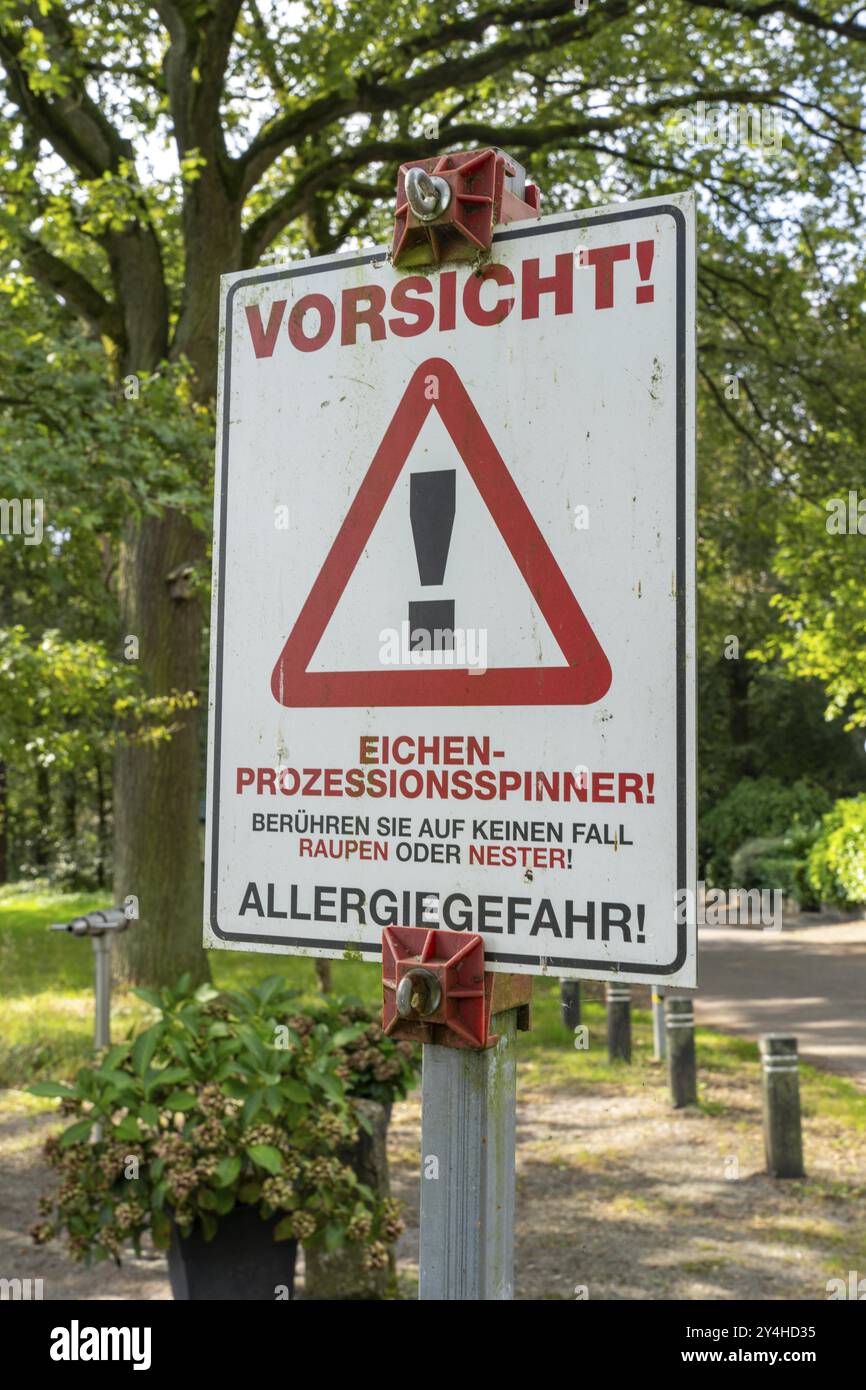 Warning of the oak processionary moth, in a public park, touching can ...