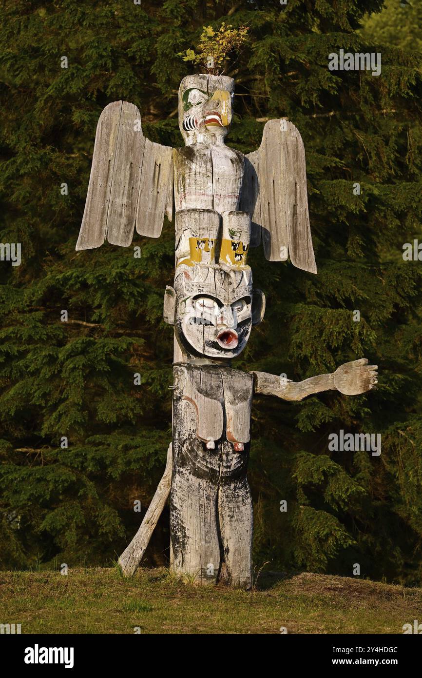 Kwakwakawakw totem pole at the cemetery in Alert Bay, Cormorant Island ...