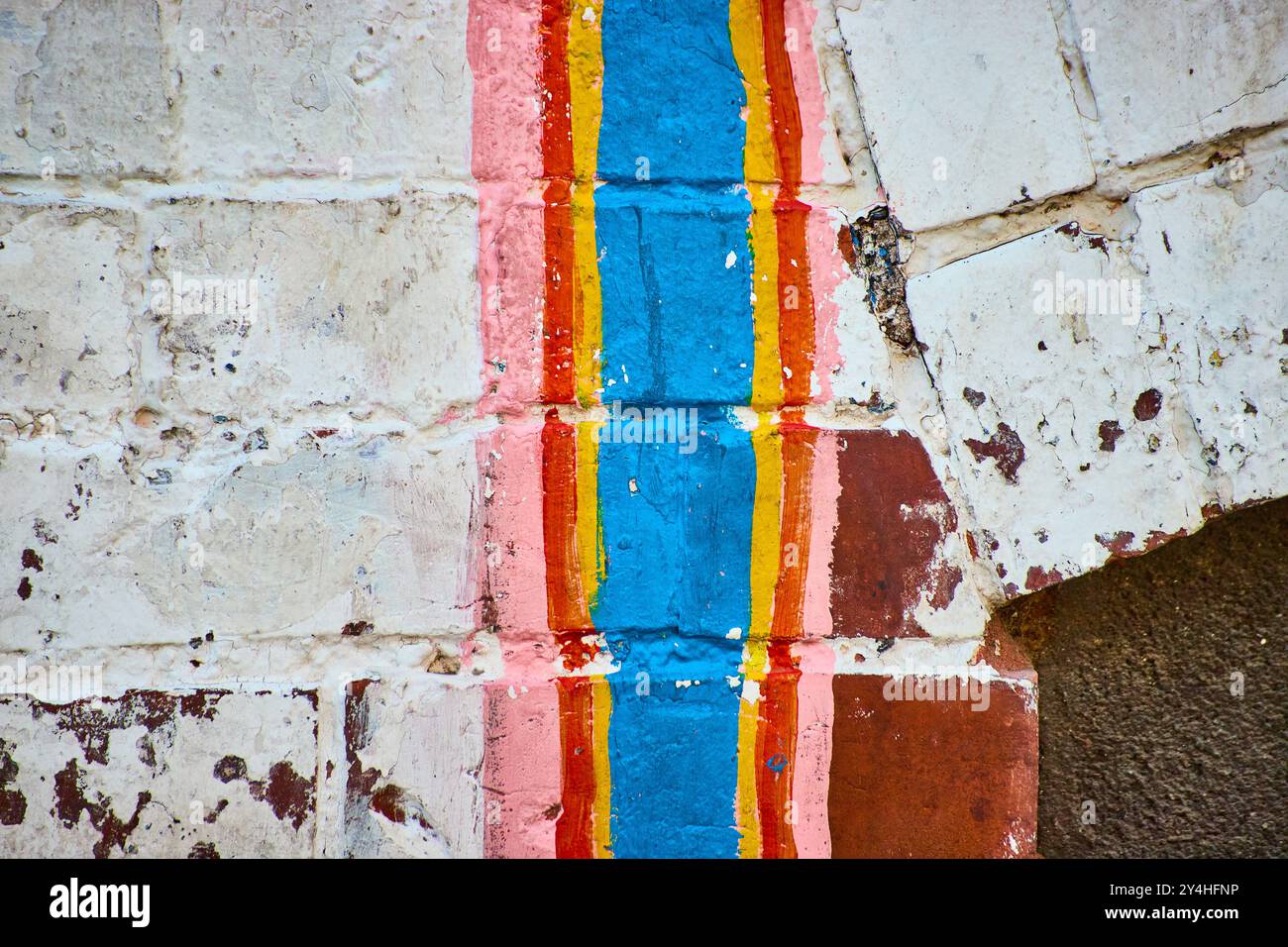 Vibrant Vertical Stripes on Textured Brick Wall Eye-Level View Stock ...