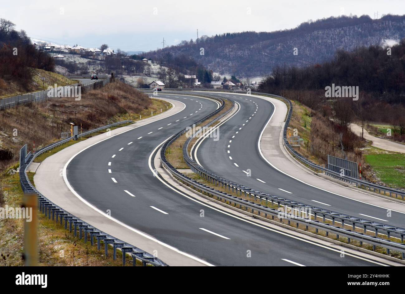 Two lanes of a modern highway. Highway curve Stock Photo - Alamy