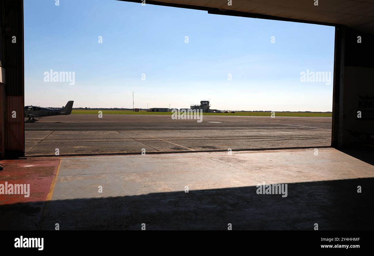 view of a Control Tower from an aicraft hangar on the apron at ...