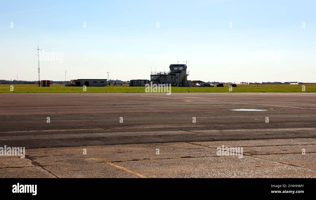 view of a Control Tower from an aicraft hangar on the apron at ...