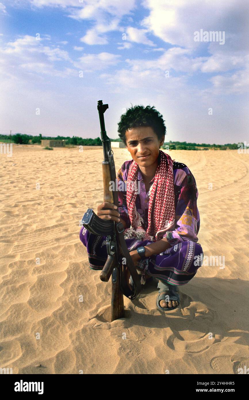 Asia. Yemen. Arabian Peninsula. Young Man With A Kalashnikov (ma'rib ...