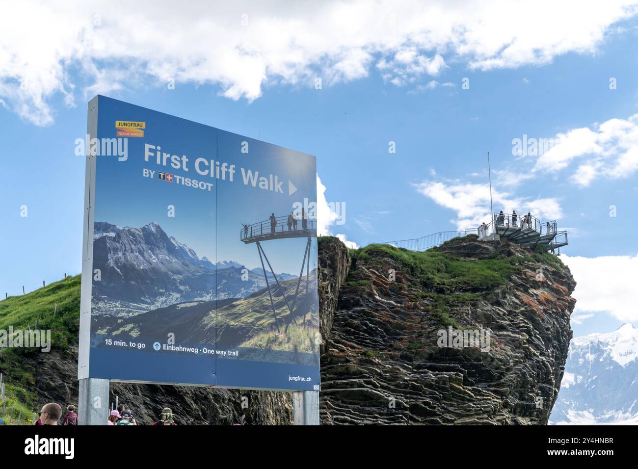 Grindelwald, Switzerland - July 20, 2024: Tourists walk on the ...
