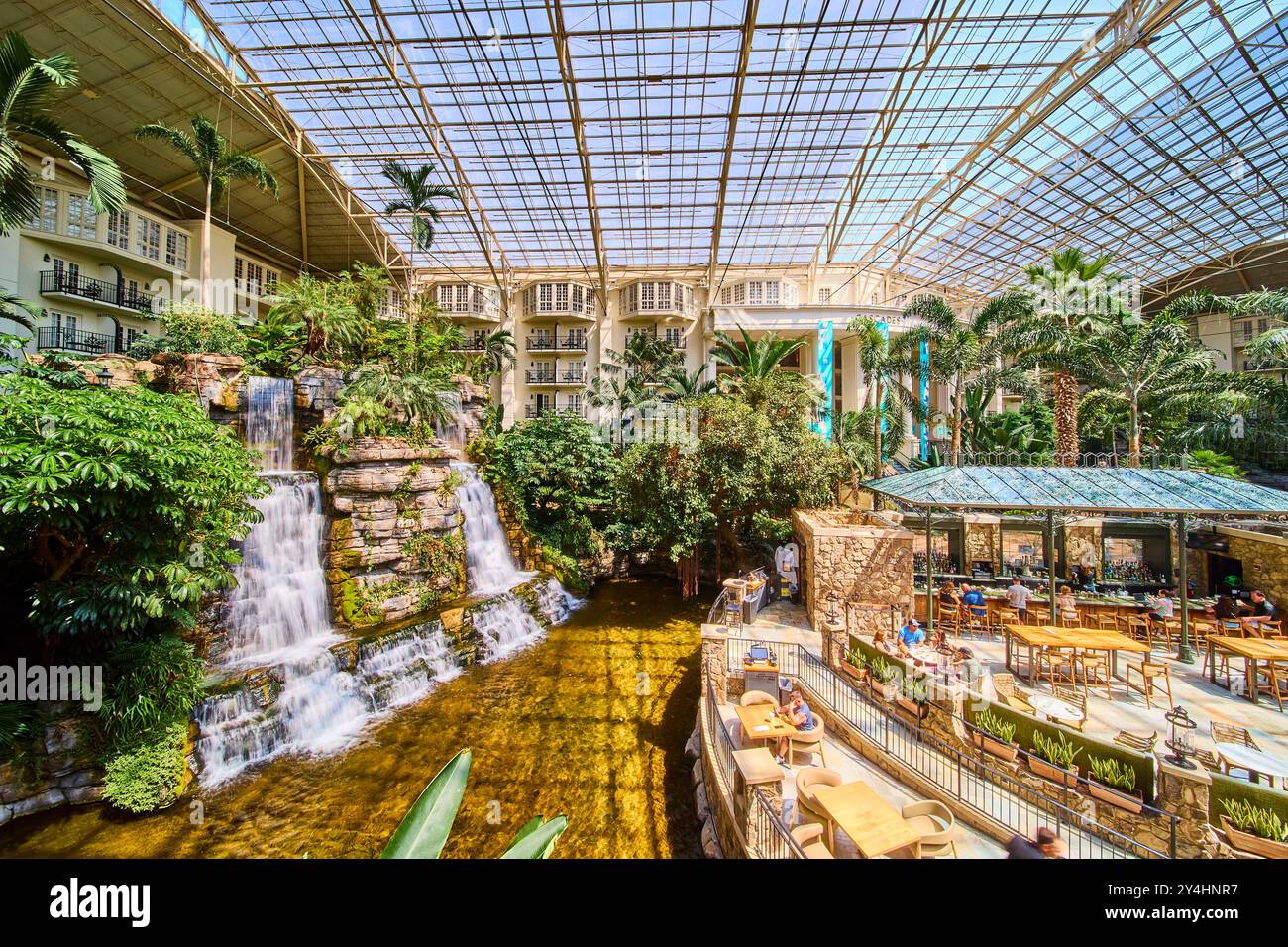 Tropical Atrium Waterfall with Lush Greenery Eye-Level View Stock Photo ...