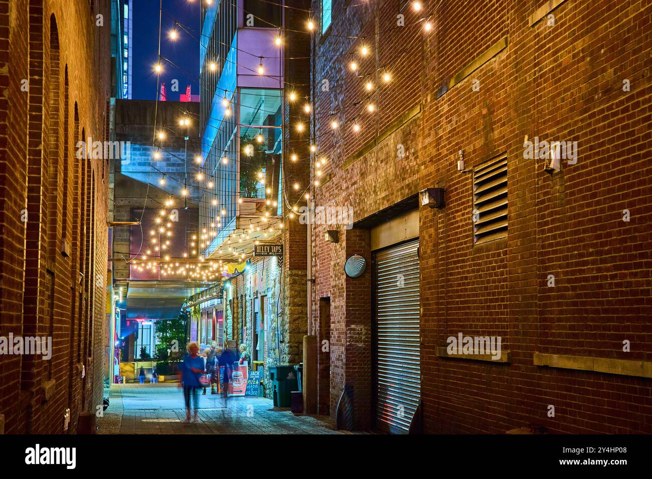 Festive Nighttime Alley with Motion Figures in Nashville Eye-Level View ...