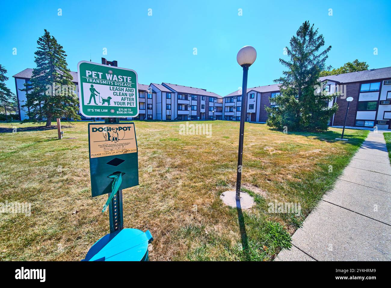 Suburban Pet Waste Station and Apartments Eye-Level View Stock Photo ...