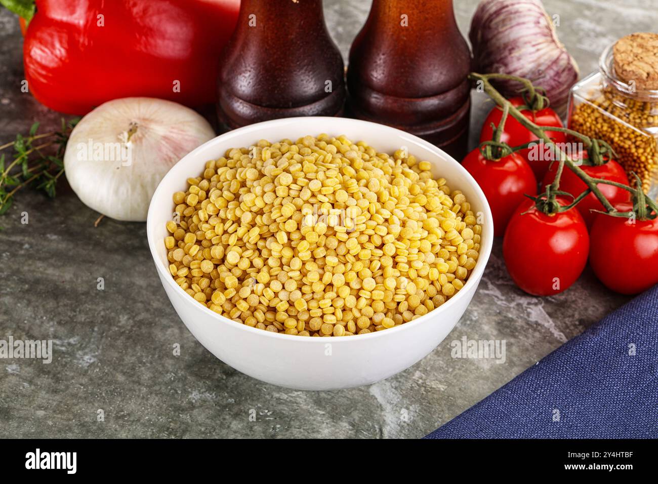 Dry ptitim heap in the bowl for cooking Stock Photo - Alamy