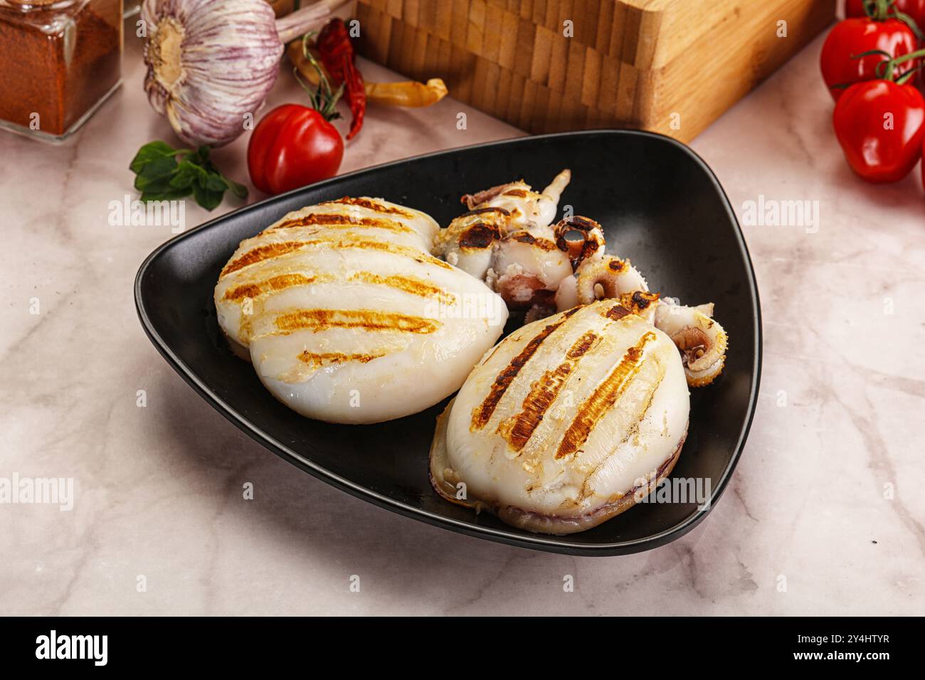 Grilled gourmet cuttlefish in the plate Stock Photo - Alamy