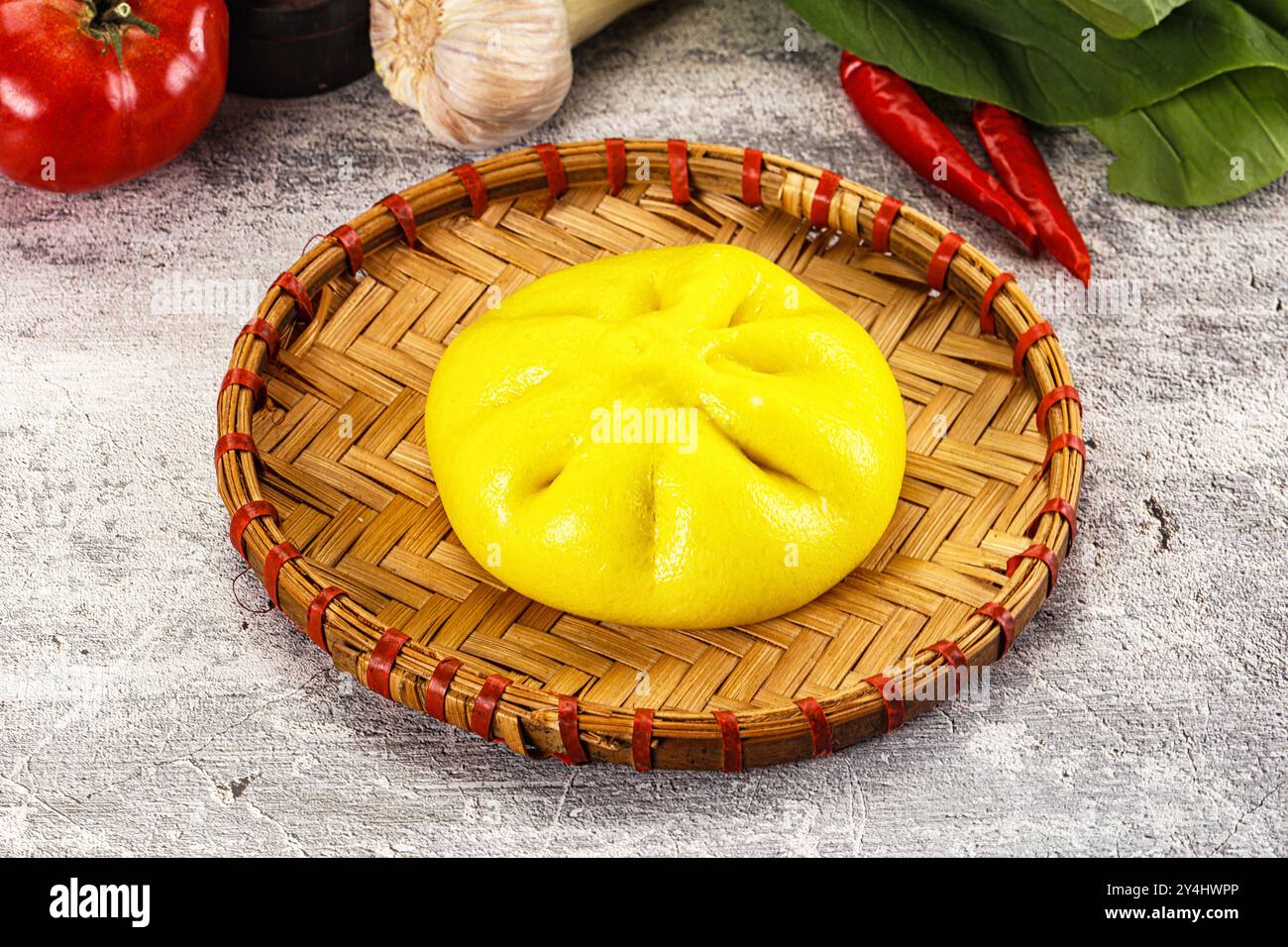Asian stuffed steamed yellow Bun Bao Stock Photo - Alamy