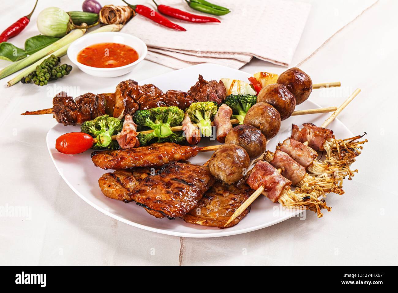 Asian grilled skewer assortment satay with beef, porl, chicken and ...