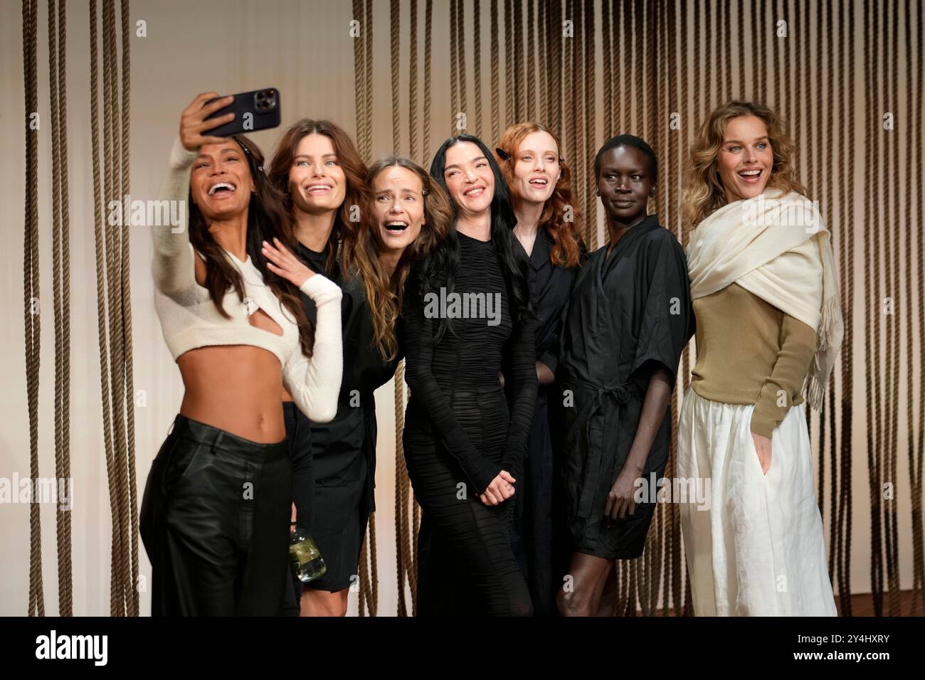 From left: models Joan Smalls takes a selfie with Isabeli Fontana ...