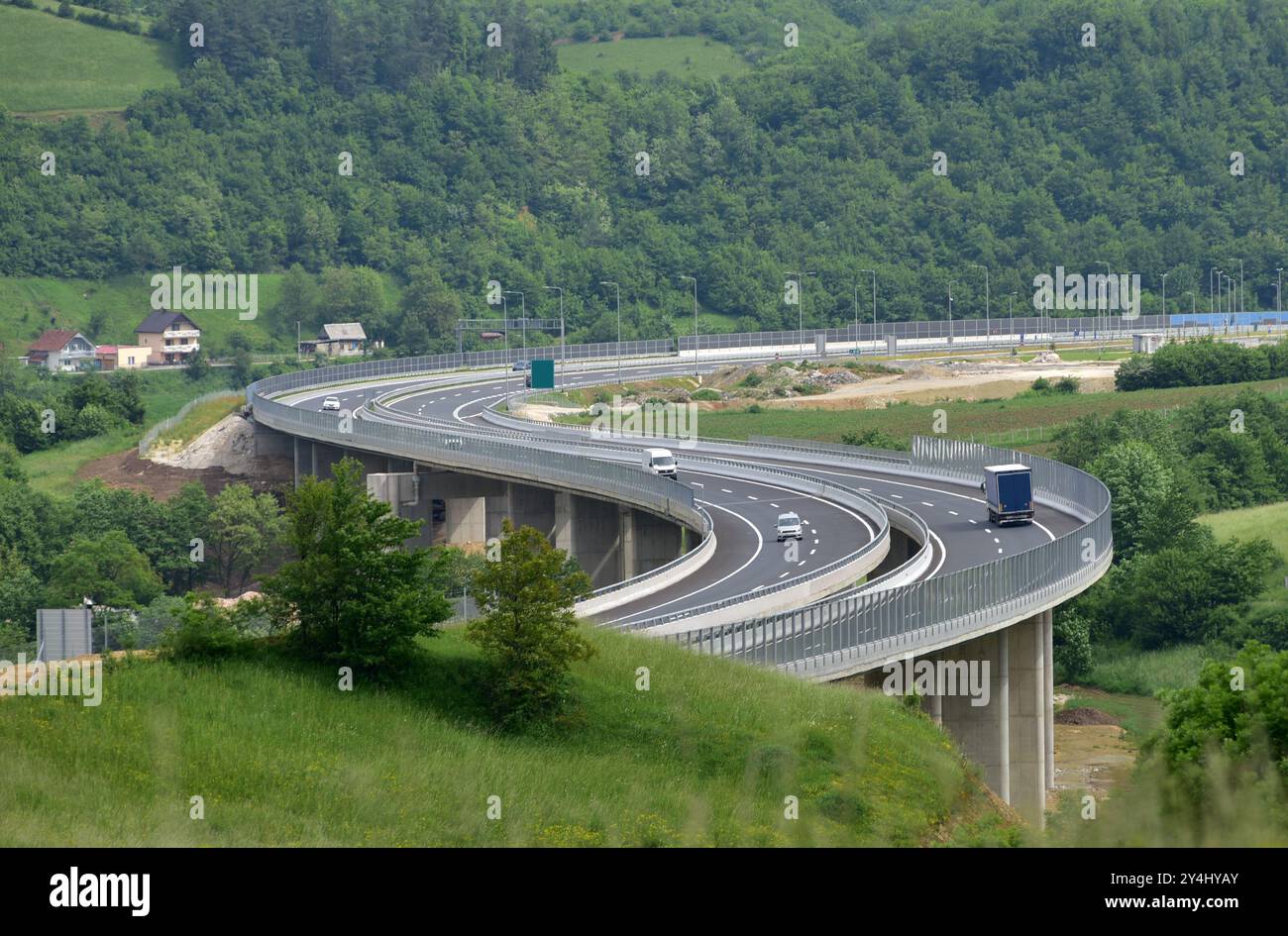 Two lanes of a modern highway. Highway curve Stock Photo - Alamy