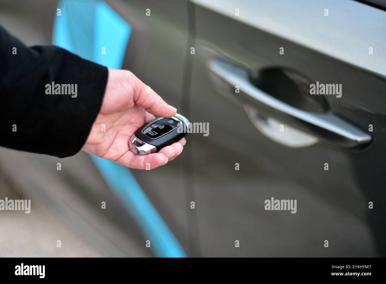A woman holds the door for a man hi-res stock photography and images ...