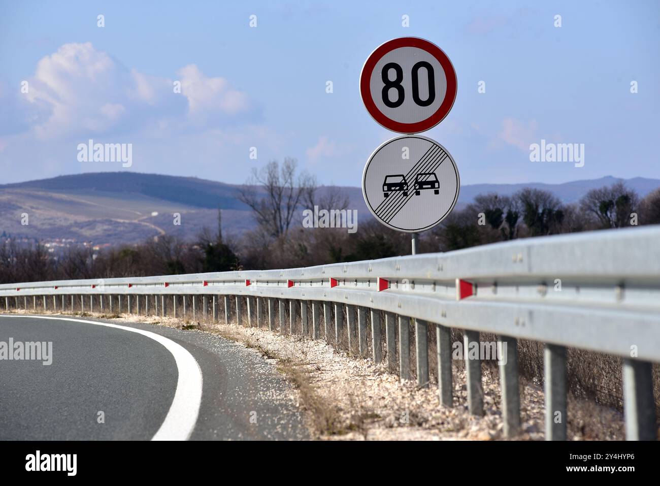 Metal fence for open road Stock Photo - Alamy