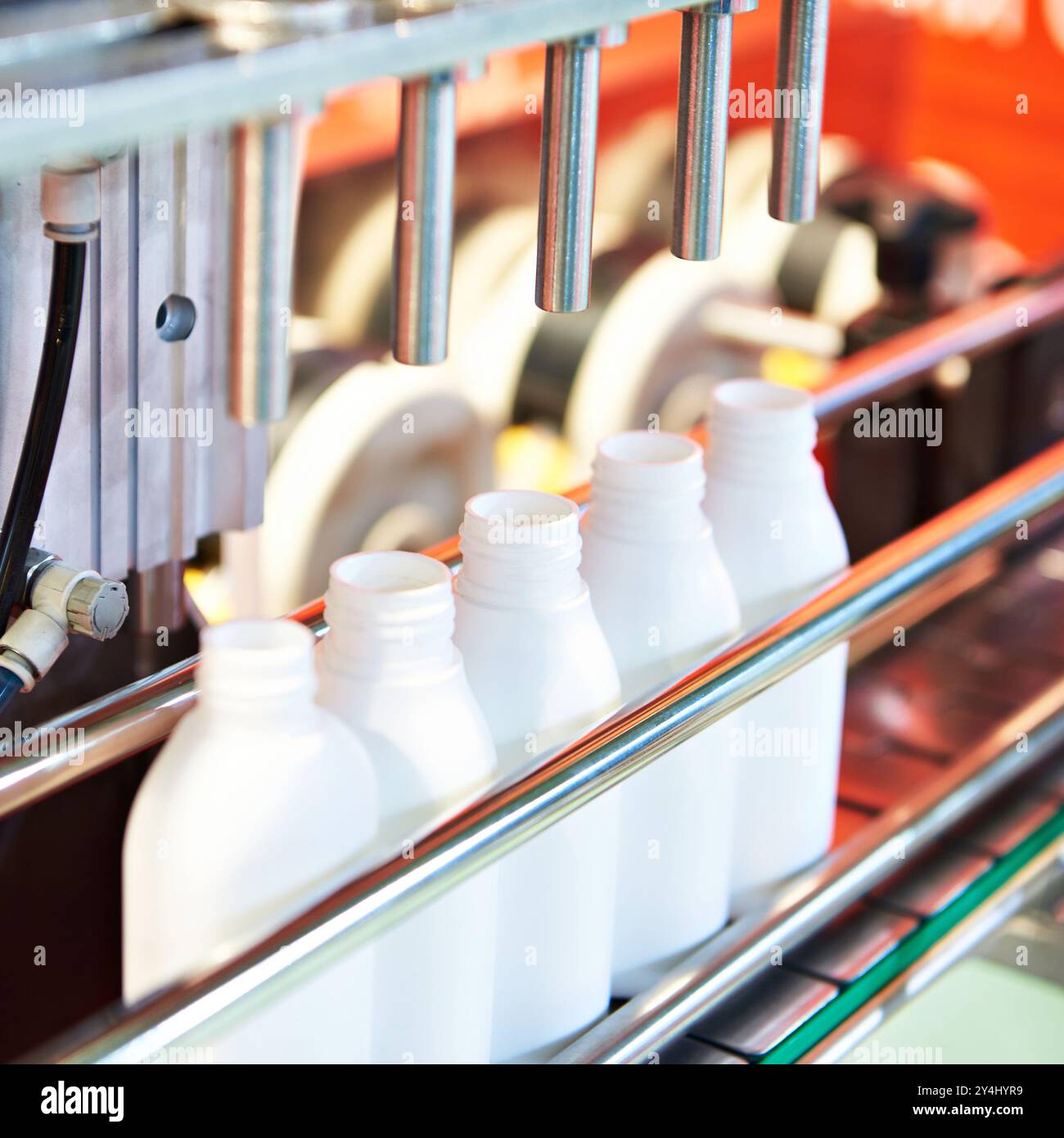 Industrial conveyor with plastic bottles on dispenser line Stock Photo ...