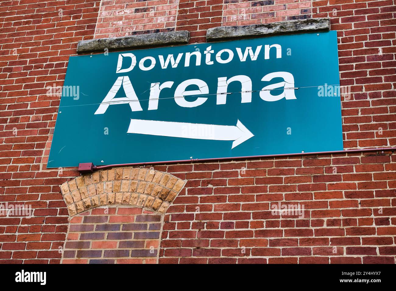 Vintage Downtown Arena arrow sign Stock Photo - Alamy